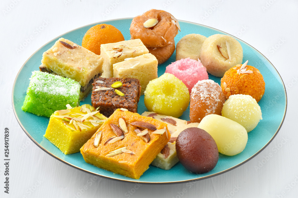 Mix Mithai or Mix Sweets in Blue Plate Stock Photo | Adobe Stock