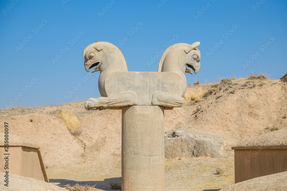 Antique sculpture of Homa or Huma bird. Griffin-like column capital ...