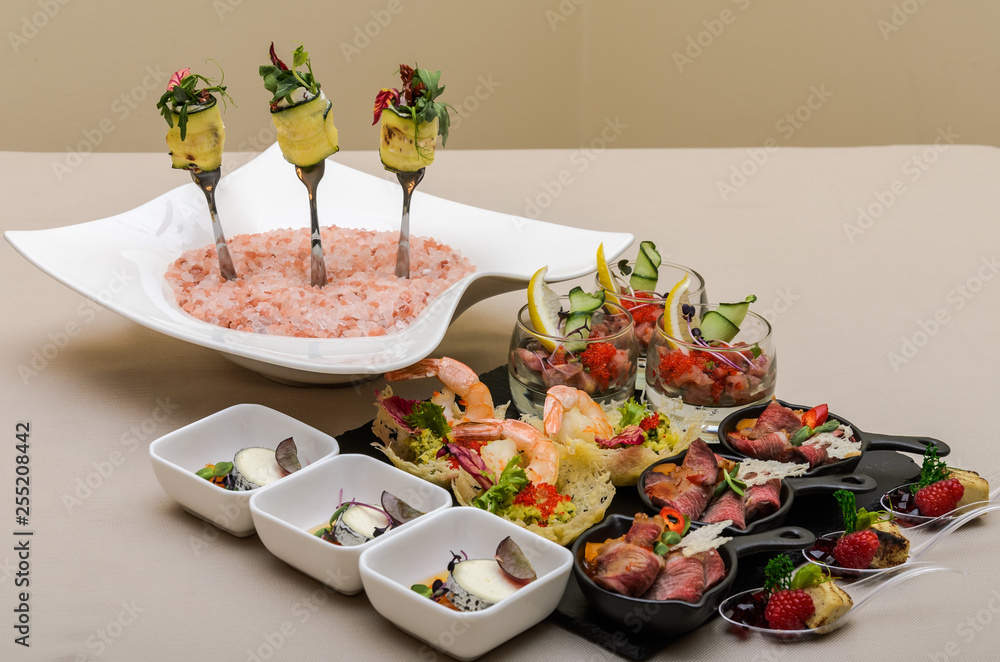 Buffet table with appetizers in a restaurant with krudite, guacamel ...