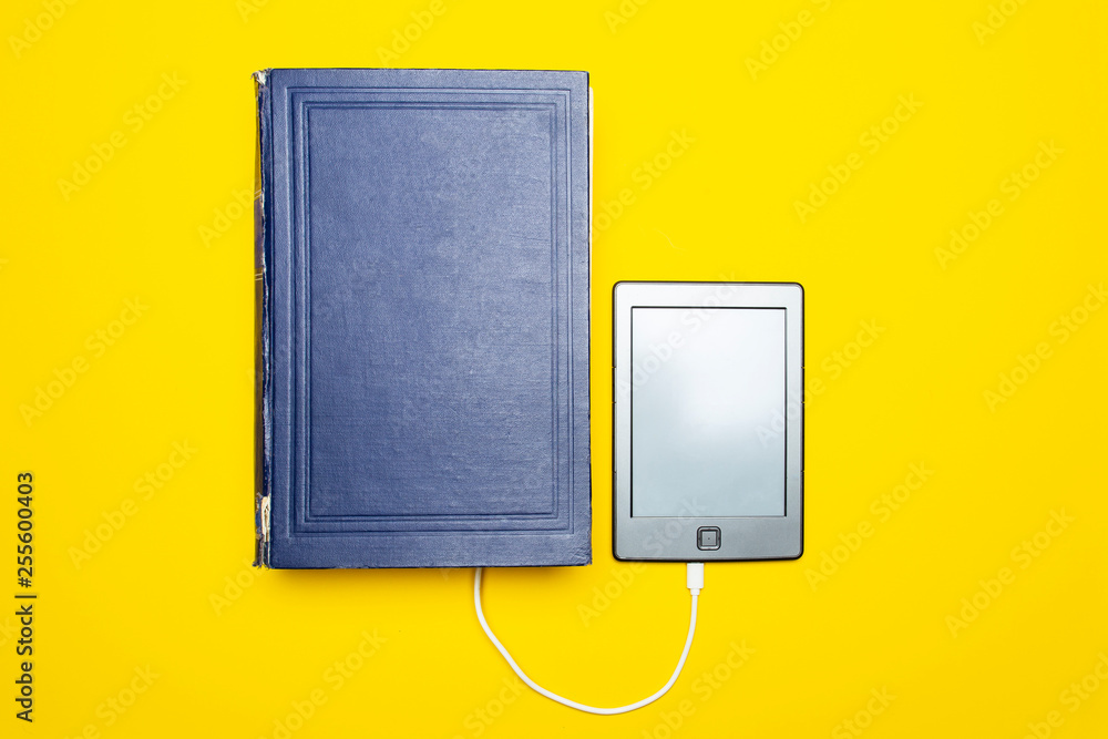 E-book connects to the old thick blue book with a cable and downloads ...