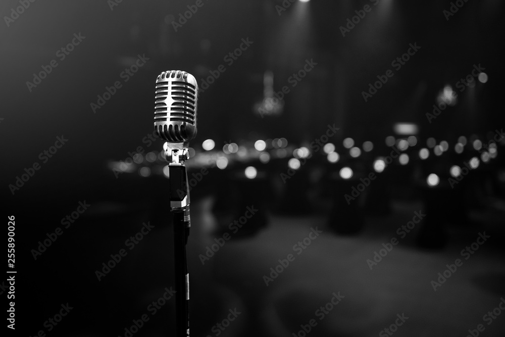 stylish 50s or 60s retro rock microphone on an empty venue stage ...