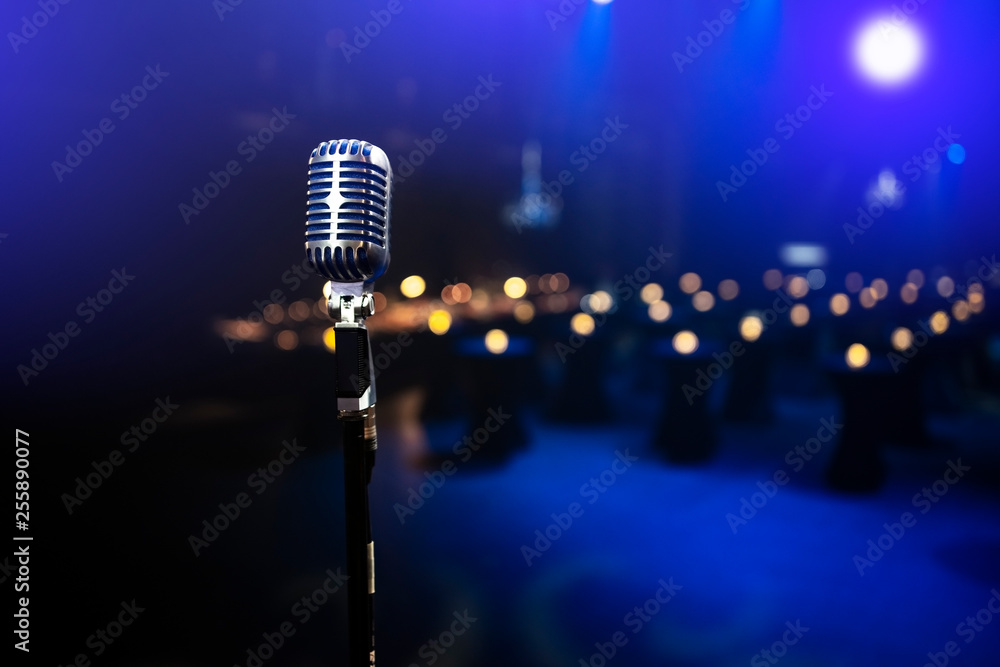 stylish 50s or 60s retro rock microphone on an empty venue stage ...