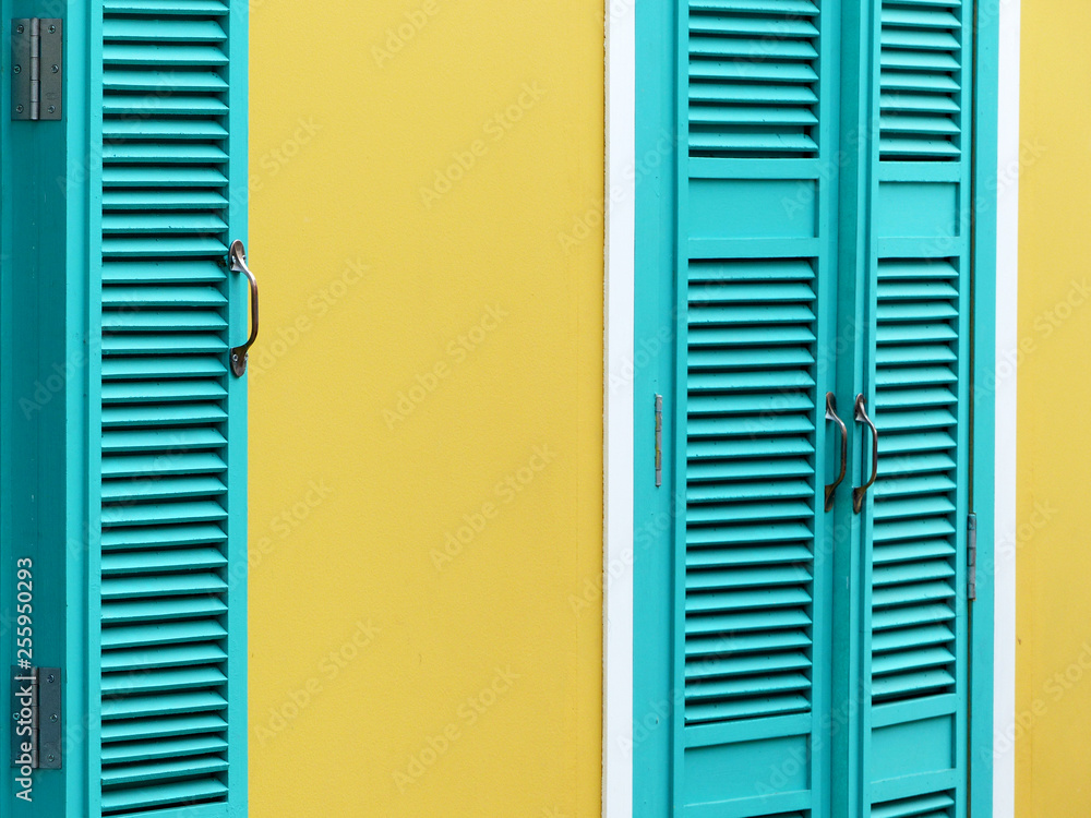 blue wood window on yellow wall Stock Photo | Adobe Stock