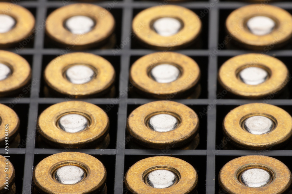 Pile of pistol bullets. The concept of limiting the spread of small ...