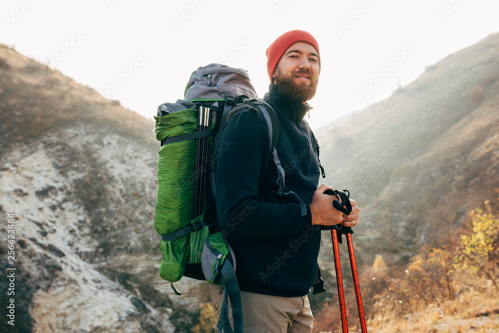 Horizontal outdoors portrait of hiker young male hiking in mountains ...