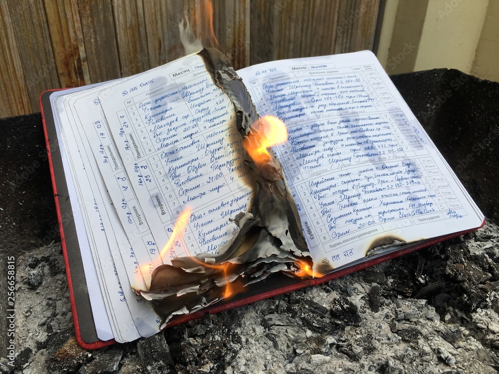 School diary with daily hand written note burning in fire flame Stock ...