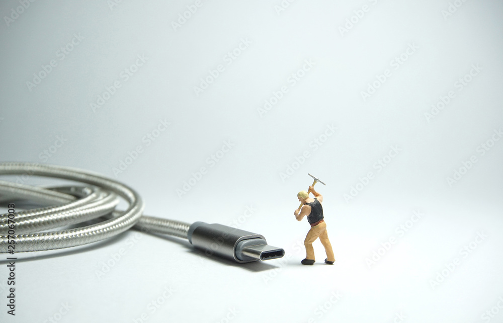 Technician worker figure standing in front of usb USB type C cable. IT ...