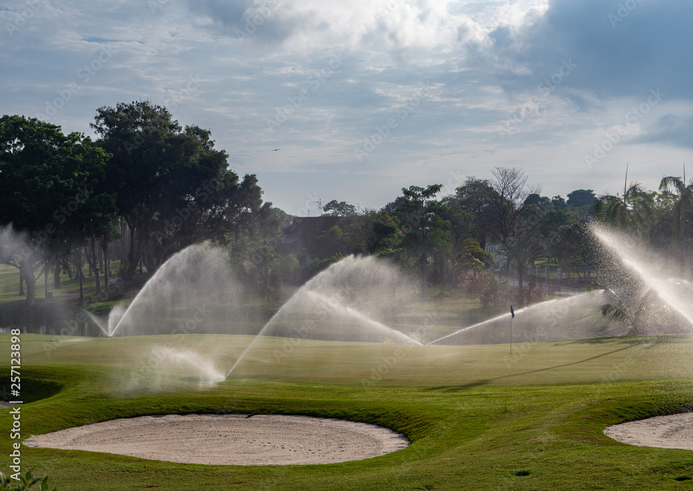Irrigation of golf course Stock Photo | Adobe Stock