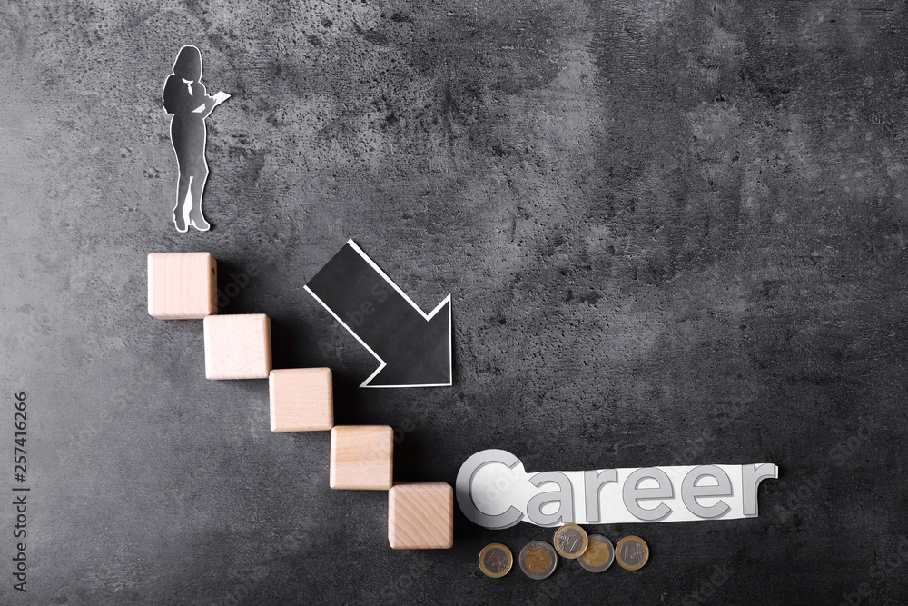 Composition with paper human figure, career ladder and arrow directed ...