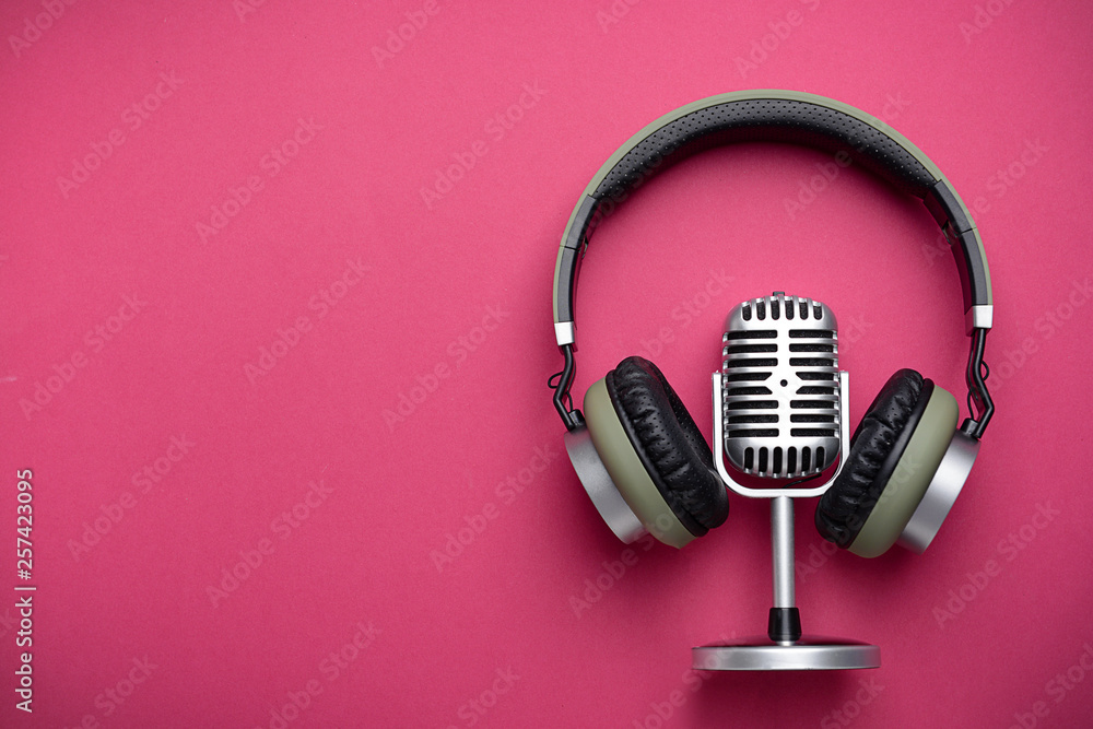 Retro microphone and headphones on color background Stock Photo | Adobe ...