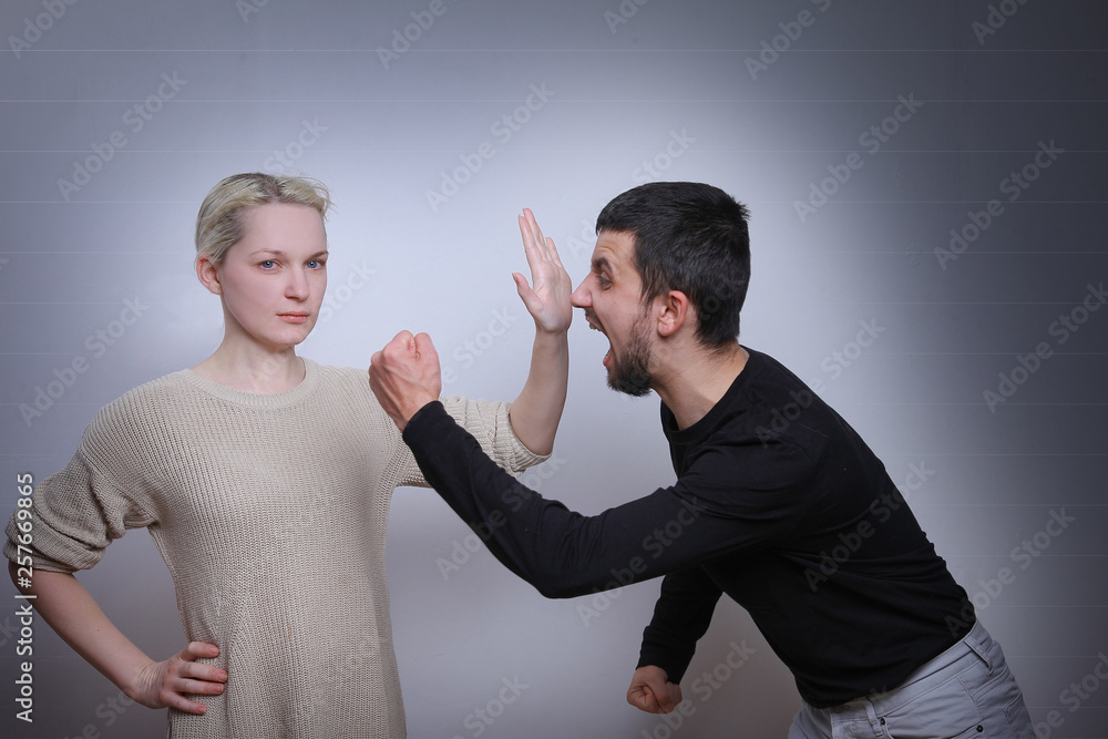 Man brandishing his wife. Husband and wife arguing, man and woman ...