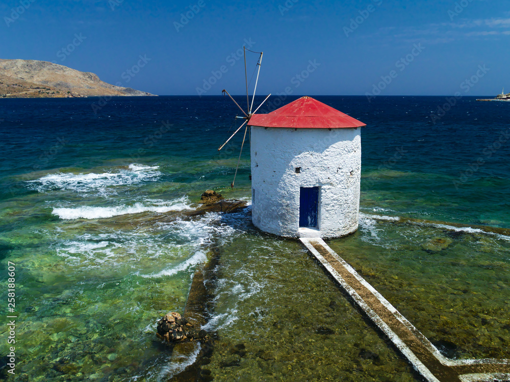 Traditional windmill in the sea. Landmark of Leros island, Greece ...