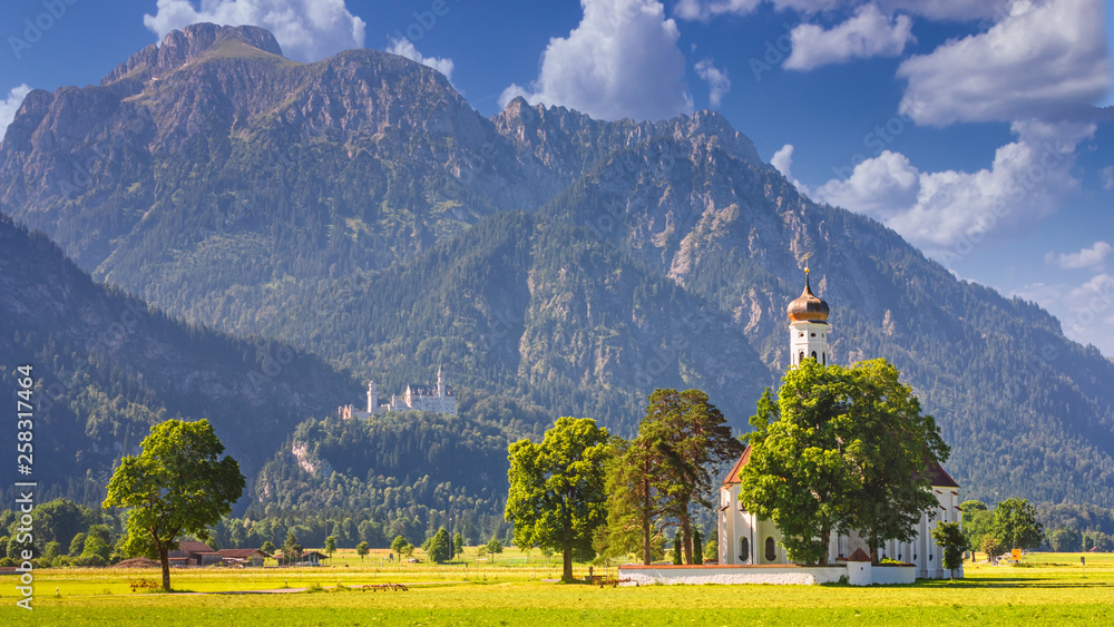 Bavarian landscape - view of the church of St. Coloman on the ...