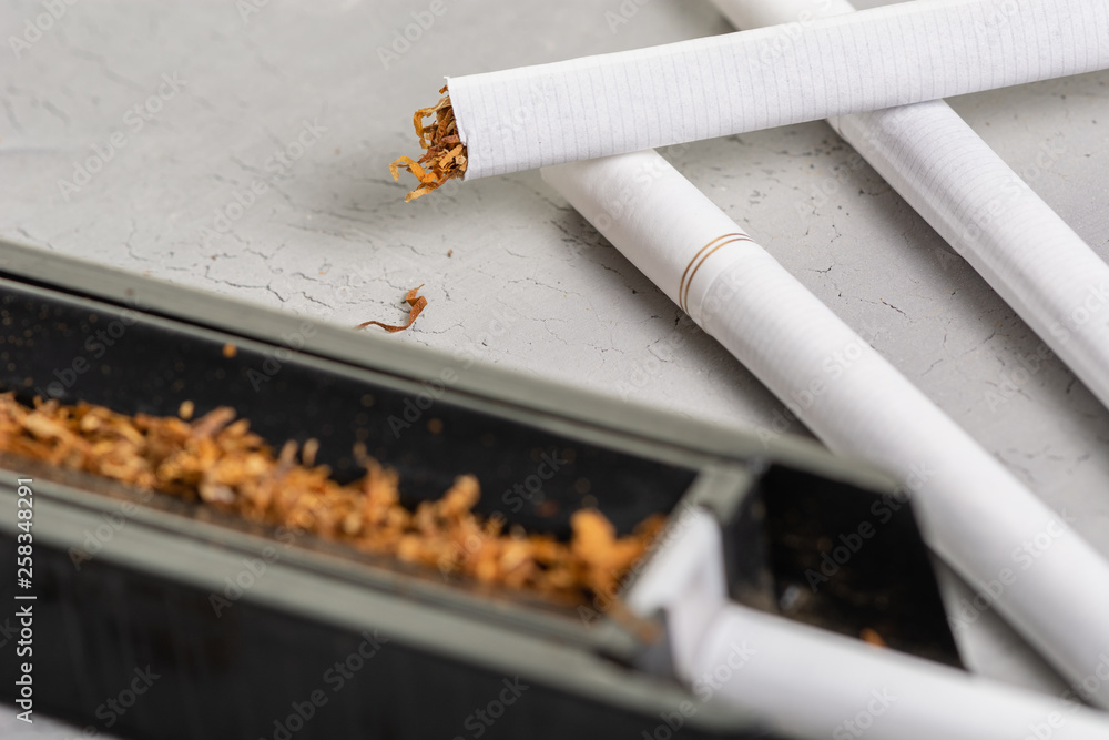 Cut and dried tobacco leaves. A device for making cigarettes at home ...