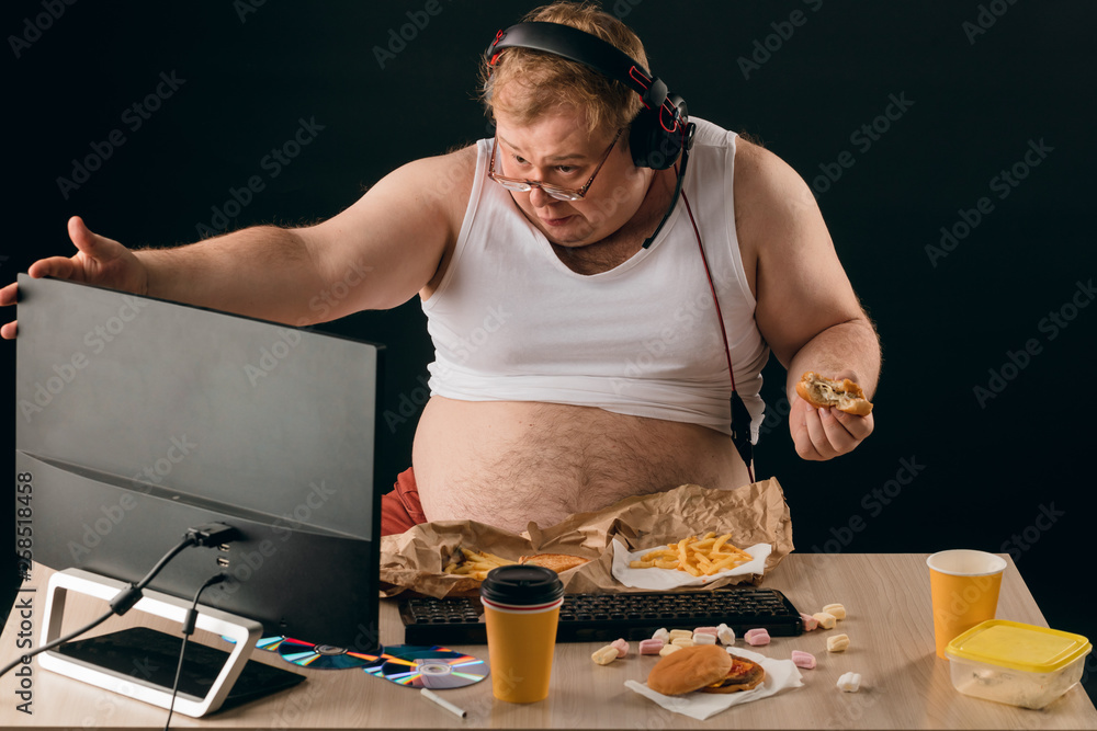 Obese man talking with a computer. close up portrait. isolated black ...