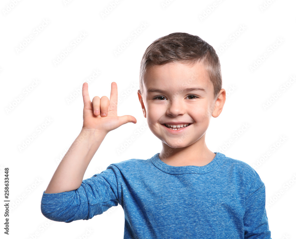 Little boy showing I LOVE YOU gesture in sign language on white ...