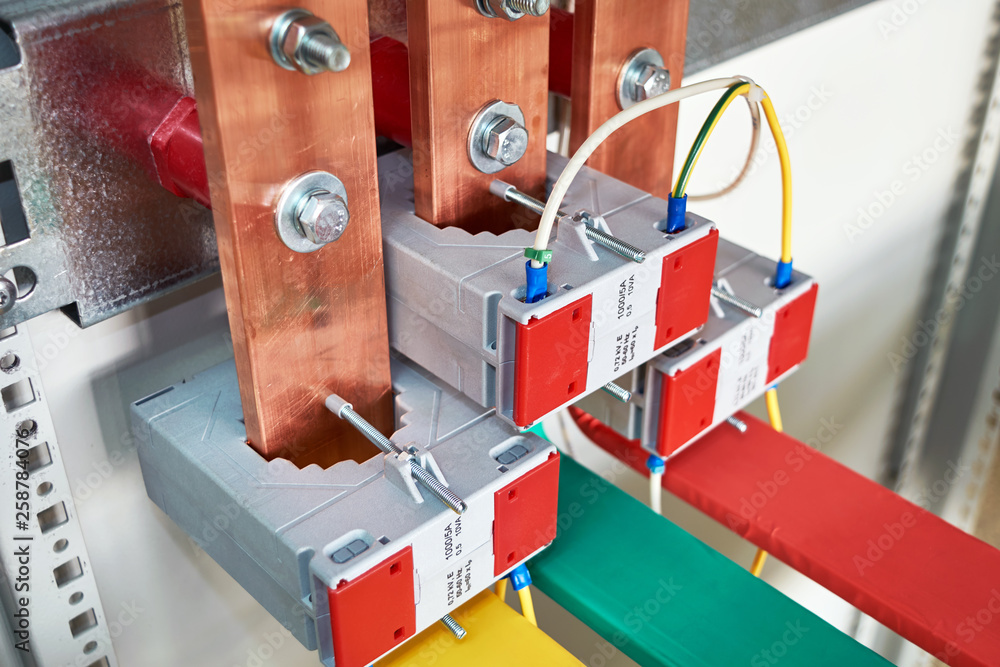 Electrical current transformers fitted on vertical copper busbars ...