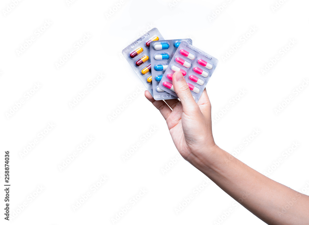 Asian adult hand holding antibiotics drug in blister pack. Woman hand ...