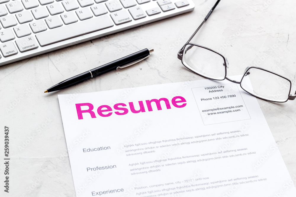 Review resumes of applicants set with keyboard and glasses white work ...