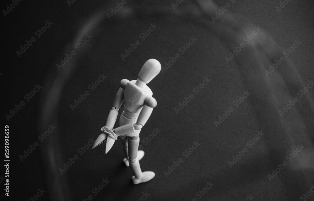 Wood man tied up with rope in emotional stress and pain, afraid ...