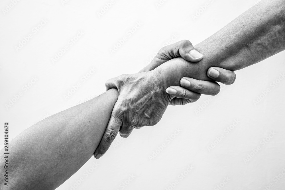 Help hands holding together in monochrome Stock Photo | Adobe Stock