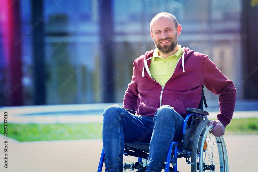 happy man on wheelchair Stock Photo | Adobe Stock