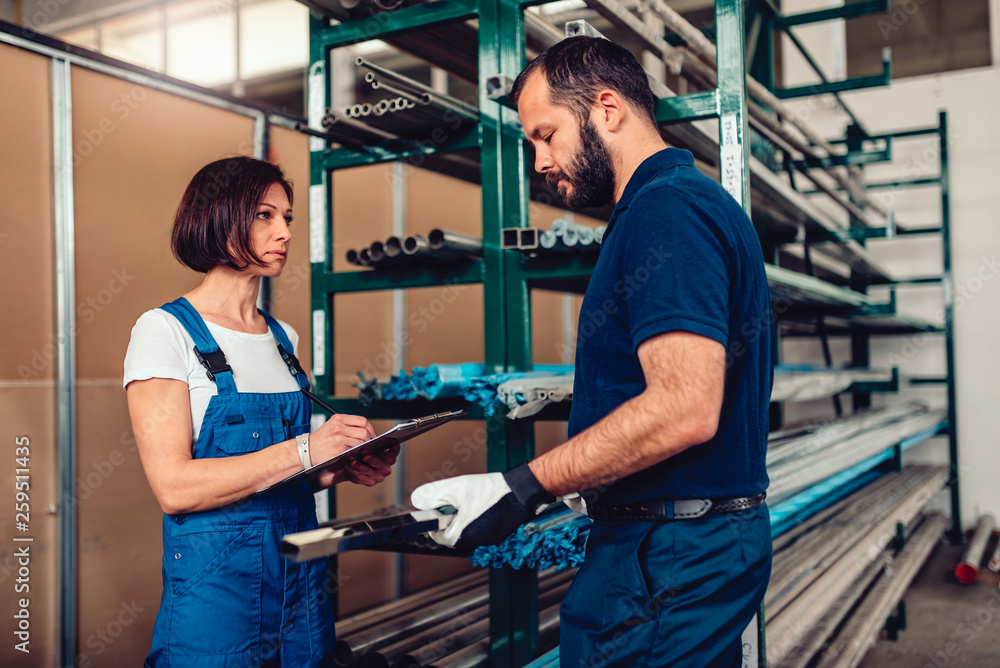 Photo Stock Female stock clerk processing purchase order with warehouse ...