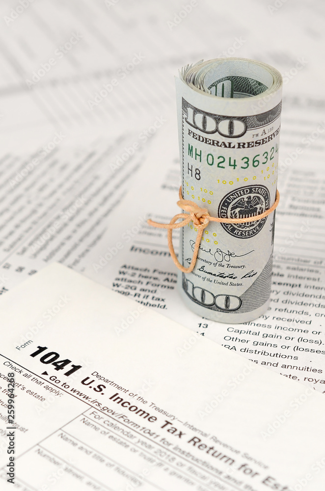 1041 U.S. Income tax return for Estates and Trusts form with roll of ...