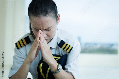 Stressed out female pilot worried at work. - Buy this stock photo and ...