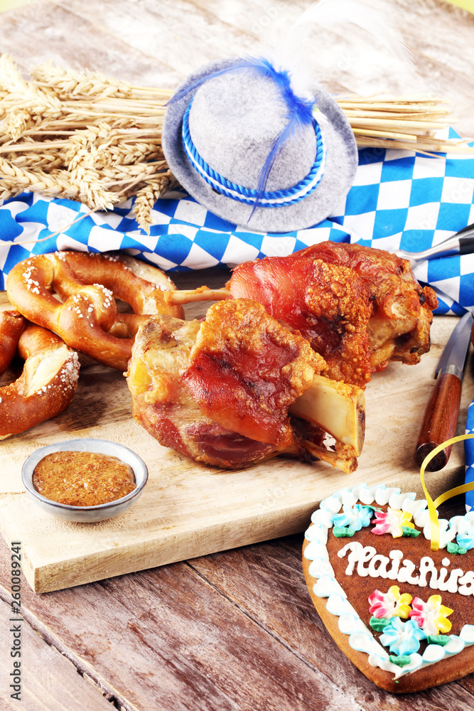 Traditional German cuisine, Schweinshaxe roasted ham hock and pretzels ...