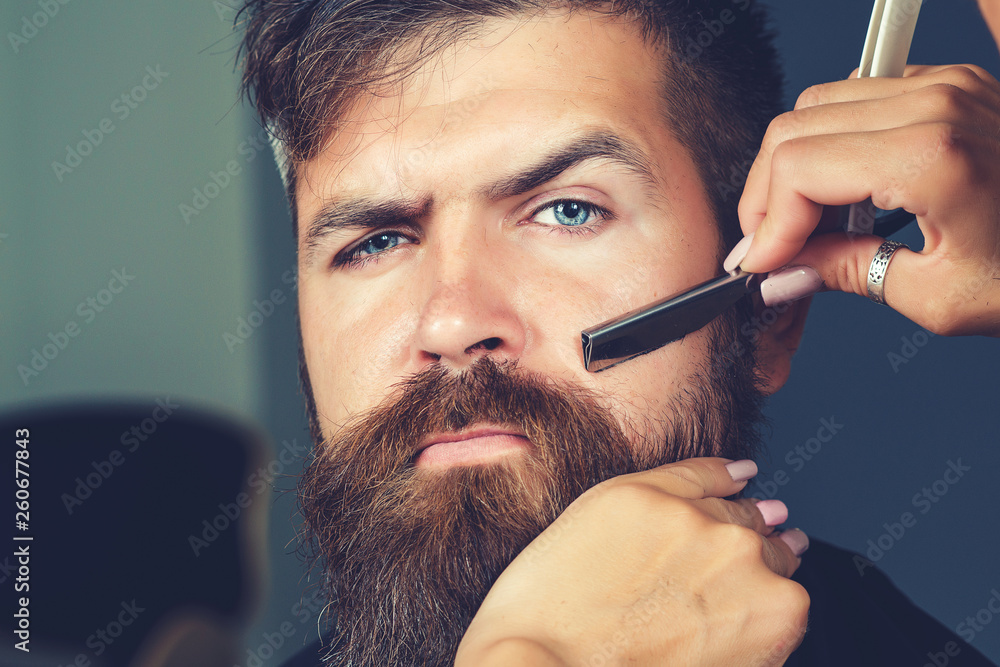 Mens haircut in barber shop. Trendy and stylish beard styling and cut ...
