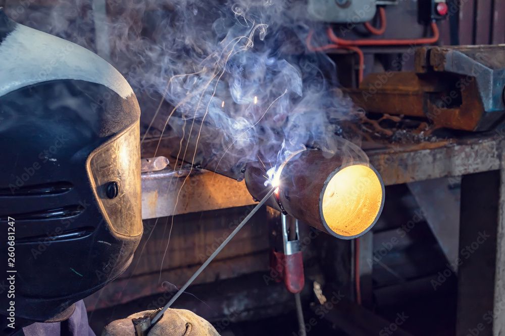 Welder brews a control sample from small diameter pipes to confirm his ...
