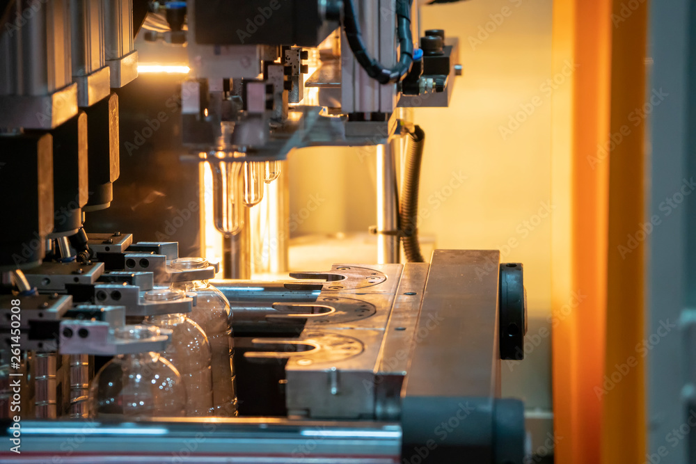 The preform shape of plastic bottles in the heater conveyor belt for ...