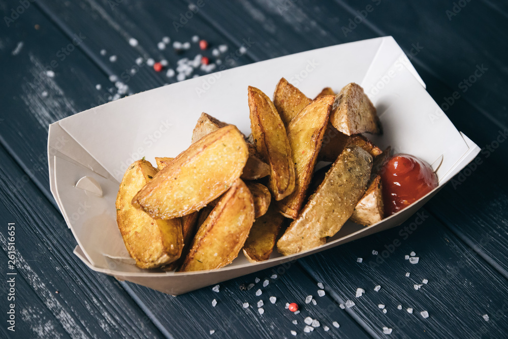 Baked potatoes.Snack in paper eco-friendly boxes. Takeout food in a ...