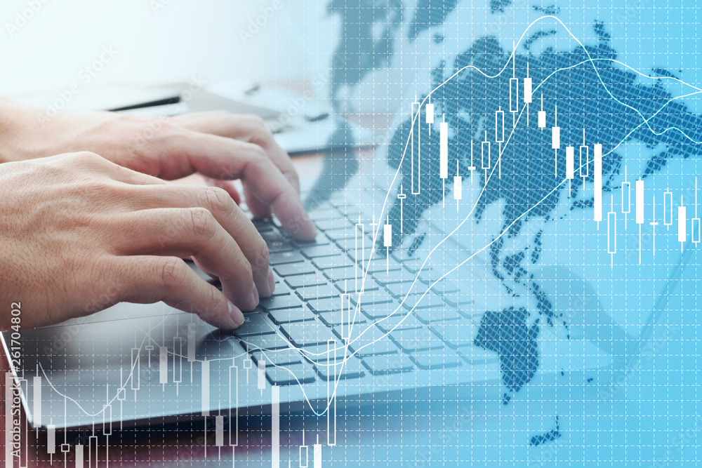 Global stock market concept. Using laptop for stock exchange.World map ...