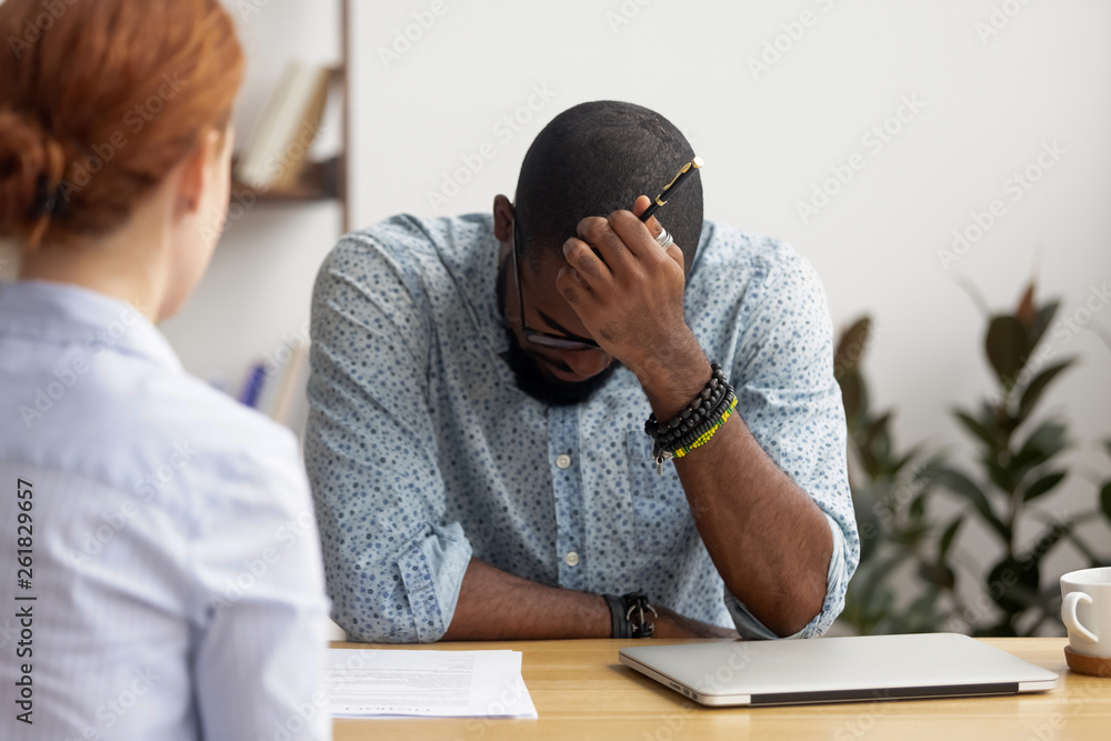 Upset african applicant depressed about rejection on failed job ...