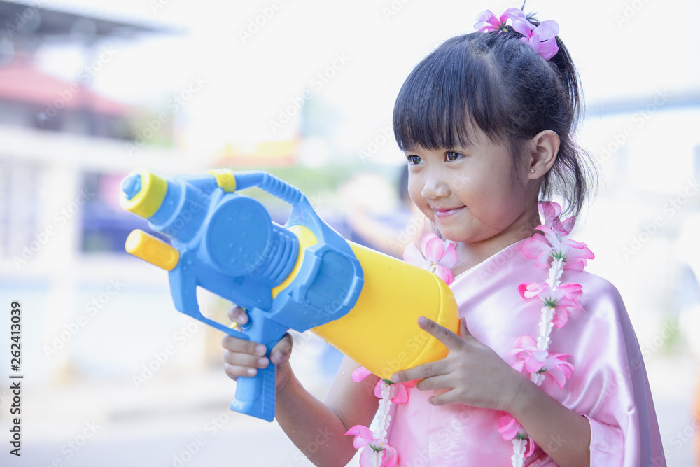 Cute kids with Songkran festival,Thai girls use water guns in Songkran ...