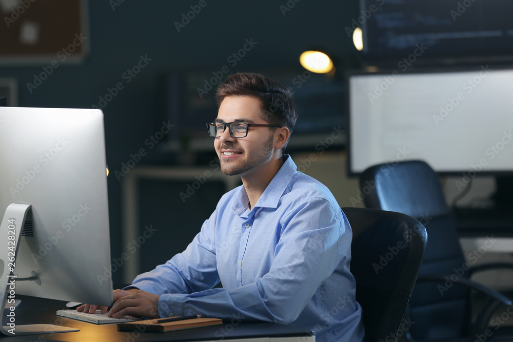 Male programmer working in office Stock Photo | Adobe Stock