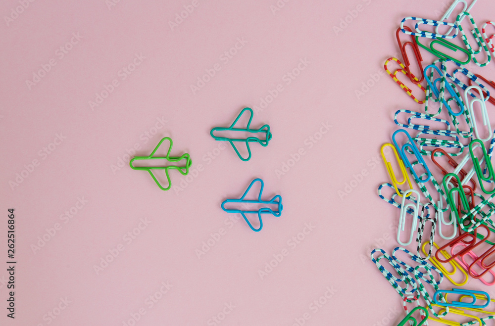 Business concept for group of stacked paperclip with group of plane ...