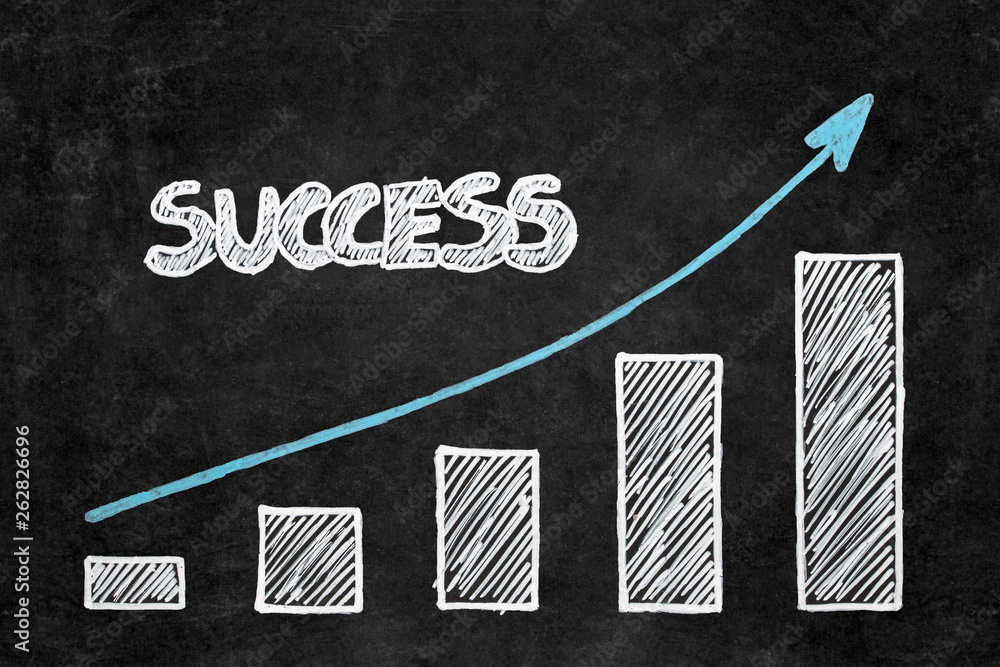 handwritten white chalk drawing graphs of success on blackboard with ...