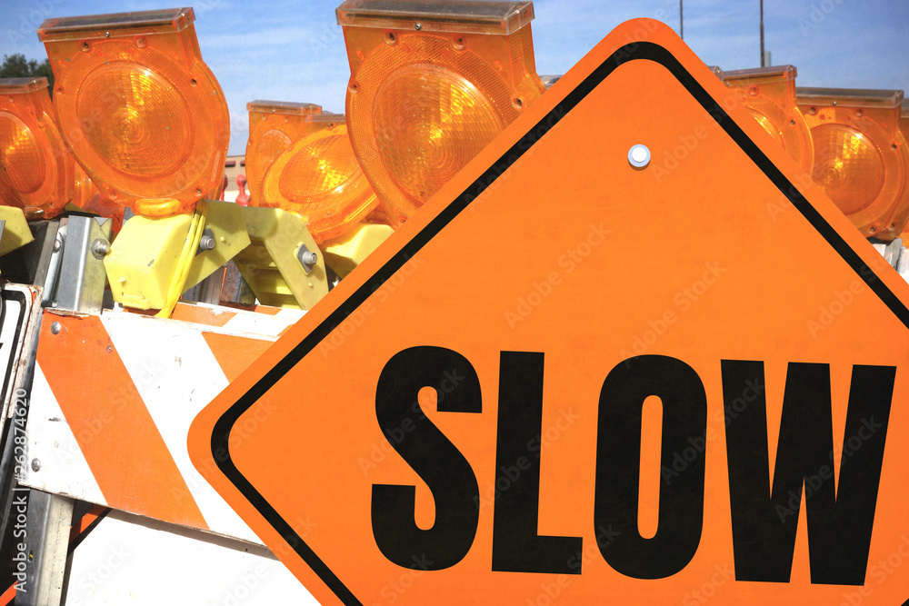 slow road work sign with safety traffic lights Stock Photo | Adobe Stock