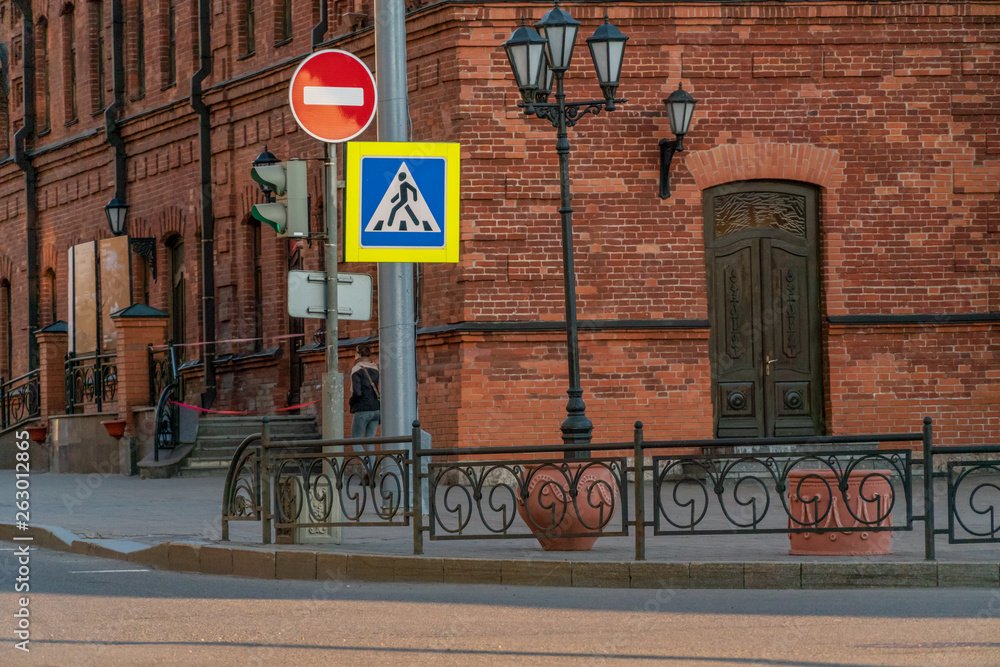 City street, road signs: pedestrian crossing sign and brick sign Stock ...