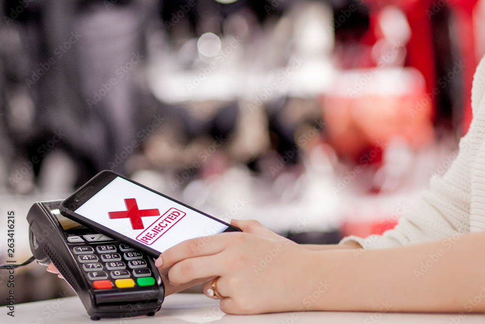POS terminal, Payment Machine with mobile phone on store background ...