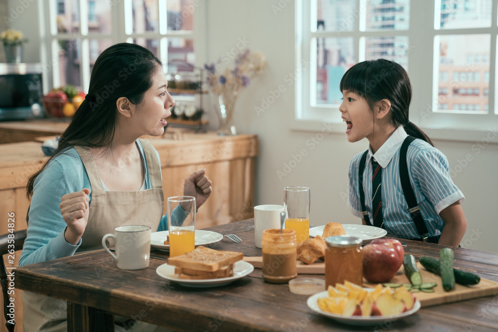 Beautiful asian woman housewife with bad little girl daughter screaming ...