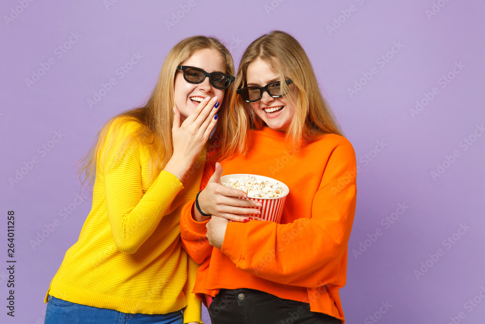Two laughing young blonde twins sisters girls in 3d imax glasses Stock ...