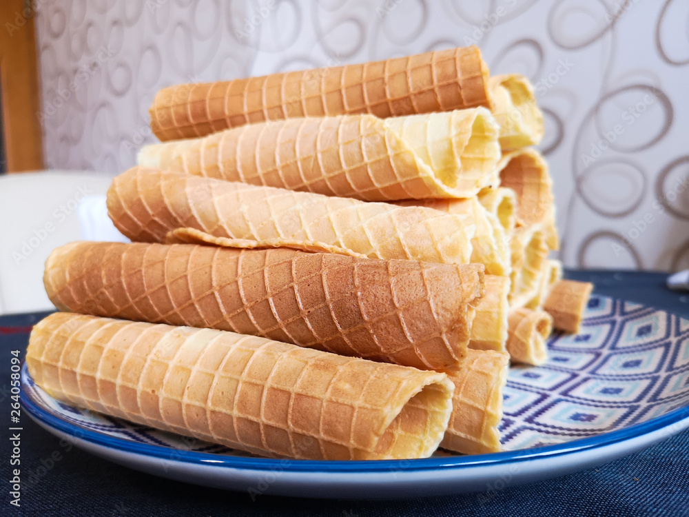 Wafer rolls, golden color. Many wafer rolls group. Edible tubules ...