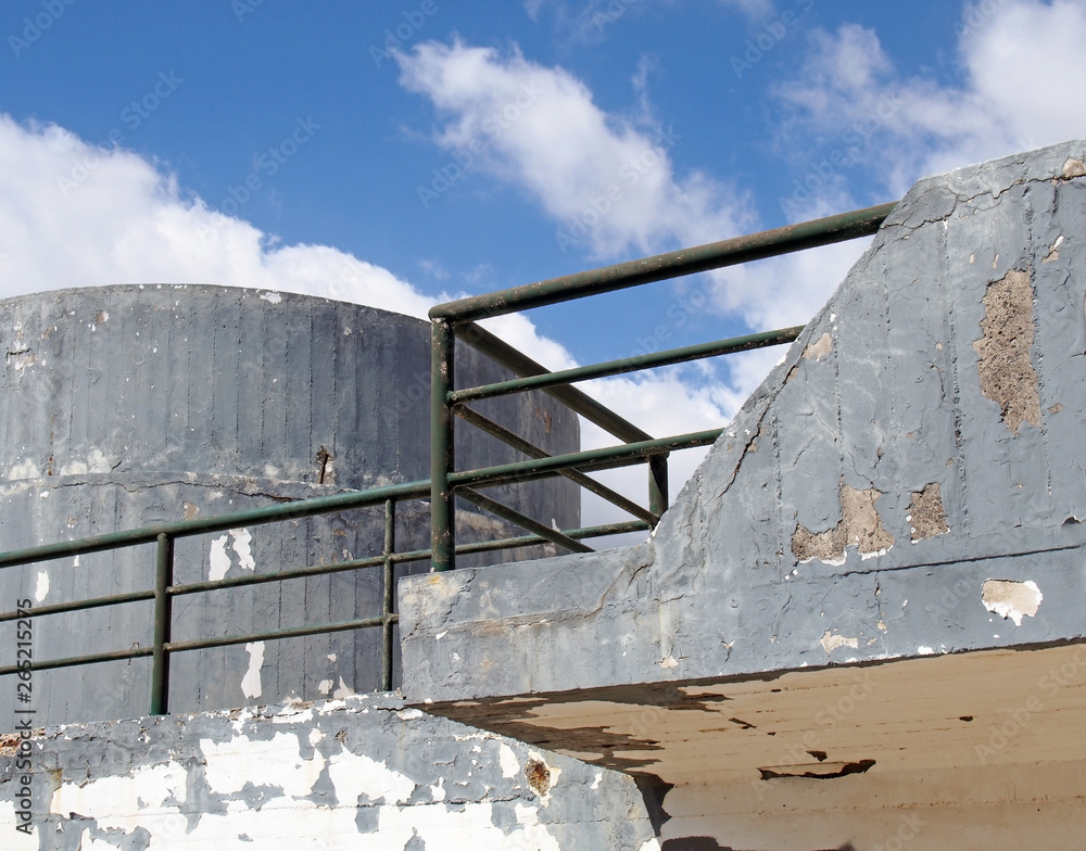 an old crumbling concrete military bunker type structure with rounded ...