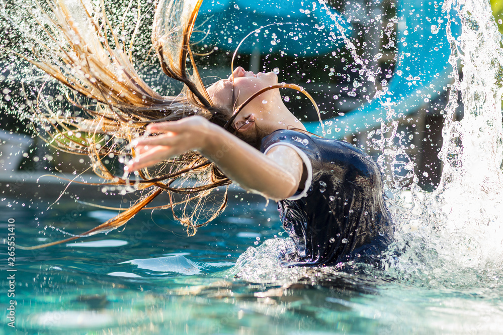 13 year old girl in swimming pool Stock Photo | Adobe Stock