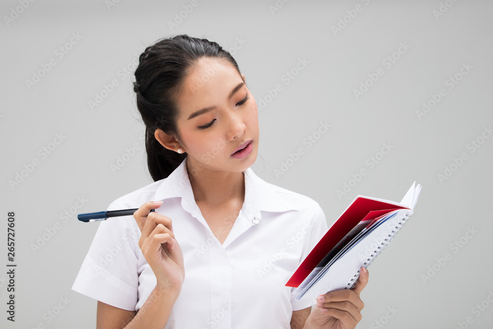 Young Asian University Student Woman in White Uniform think smile and ...