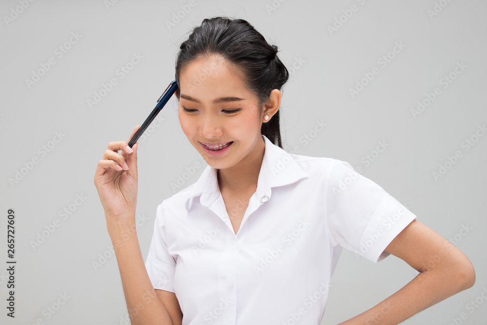Young Asian University Student Woman in White Uniform think smile and ...